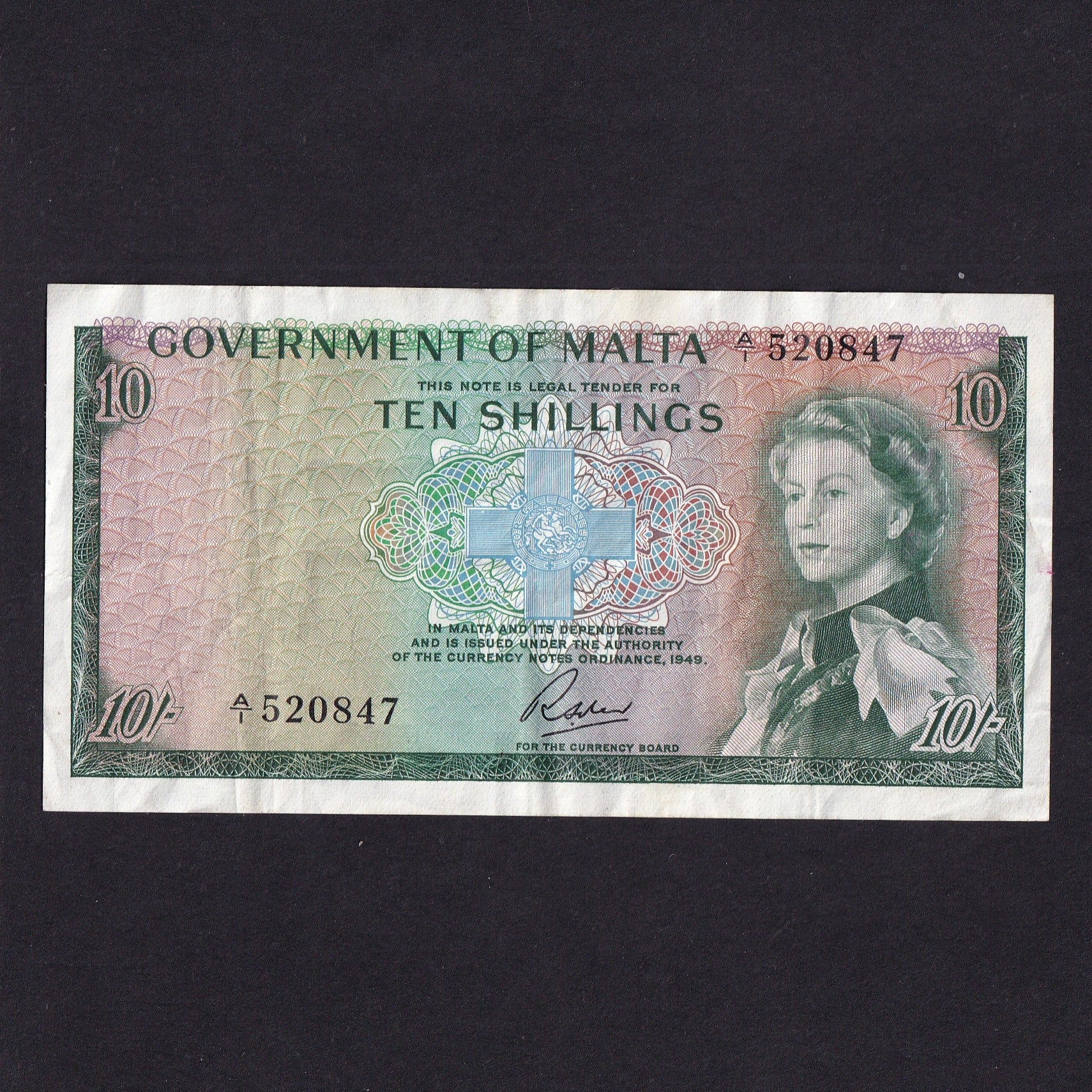 Malta (P25a) 10 Shillings, QEII, green, A/1 520847, slight rust, A/VF ...